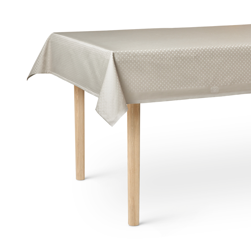 Damaskvævet dug med snefnug i beige